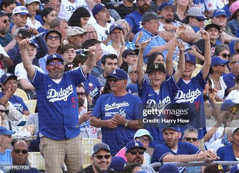Los Angeles Dodgers Fans Hold Up Syringes During An At Bat By News