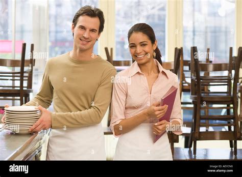 Male And Female Servers In Restaurant Stock Photo Alamy