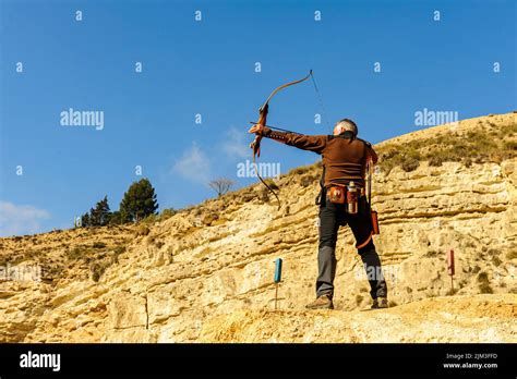 Man With Bow And Arrow Practicing Archery In Park Stock Photo Alamy