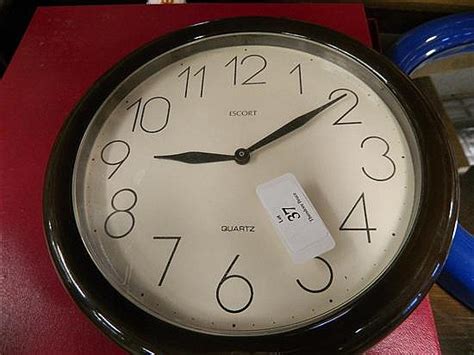 Lot An Escort Quartz Wall Clock
