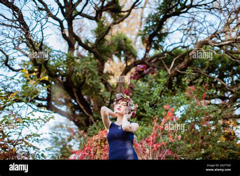 Sensual Woman Over The Autumnal Old Oak Tree Stock Photo Alamy