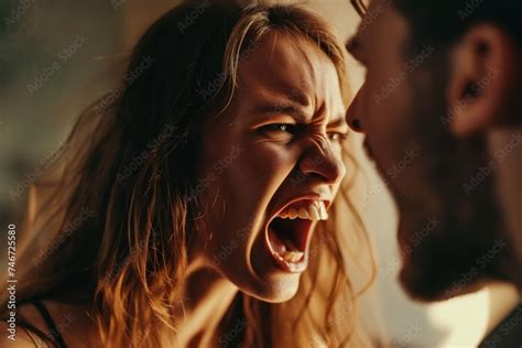 Angry Young Adult Caucasian Woman Yelling Versus Her Husband On Light