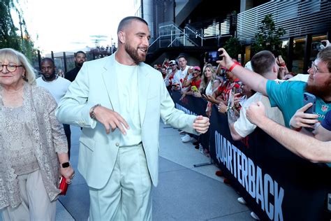 Travis Kelce Chugs Beer Behind Shirtless Jason Kelce Cutout Amid Chiefs