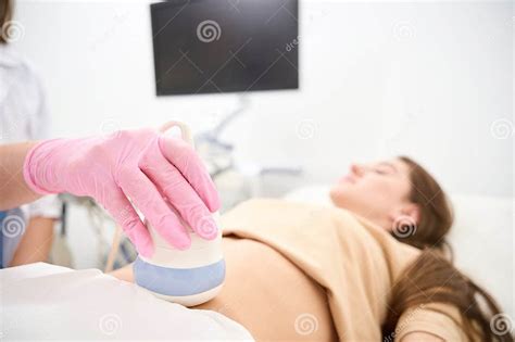 Focus Of Ultrasound Scanning Of Woman Pregnant Belly Doing Female