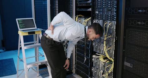 Data Center Man Programmer Using Laptop Computer Maintenance It