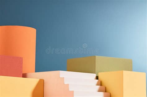 Geometric Shape Podiums Decorated Against Blue Background With Vacant