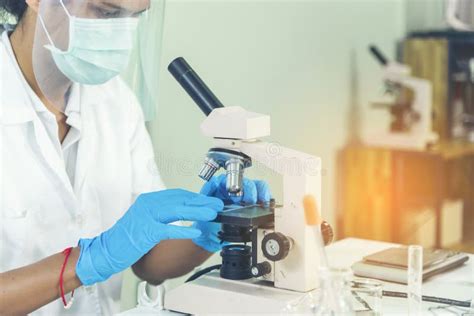 Indian Scientist Man Look Into Microscope Research In Science