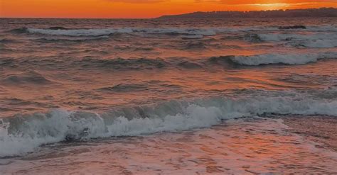 Vibrant Sunset Over Ocean Waves At The Beach Free Stock Video Footage