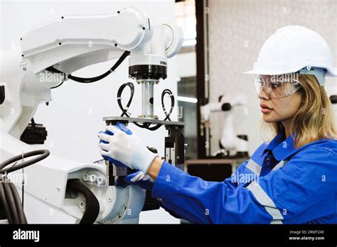 Female Automation Machine Engineer Student Study And Inspection Control Robot Arm Machine In