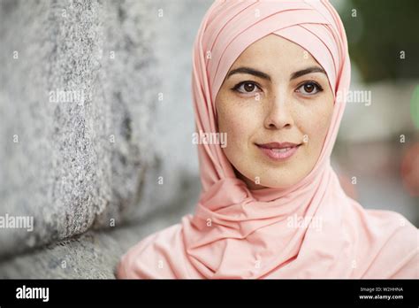 Close Up Of Content Pensive Young Muslim Woman With Freckles Wearing