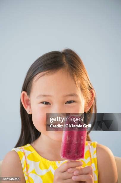 Girl Eating Frozen Treat Photos And Premium High Res Pictures Getty