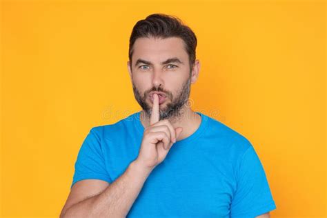 Guy Having Secret And Holding Finger On Lips Male Model Asks To Be
