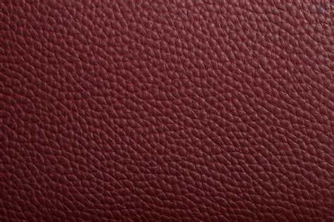 Una Textura De Cuero Rojo Con Un Patrón De Piel Texturizada Foto Premium