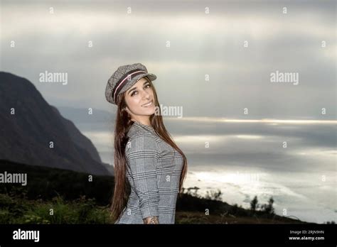 Urban Elegance A Confident Young Brunette Flaunting Edgy Style With A