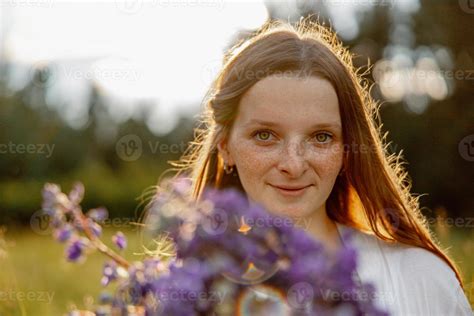 Close Up Portrait Of Young Beautiful Redhead Woman With Freckles