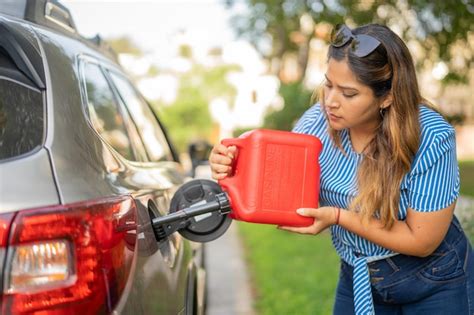 Premium Photo Woman Putting Gasoline In Her Car