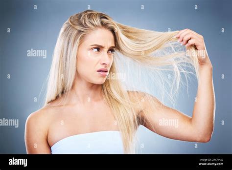 Upset Angry And Annoyed Woman With Hair Problem Or Style Issue On A
