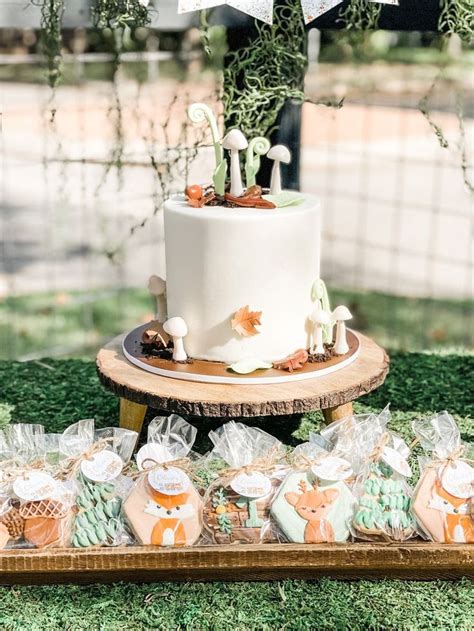 A White Cake Sitting On Top Of A Wooden Table