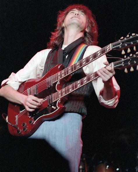 Jimmy Page Leaning Back While Playing Guitar At Arms Charity Concerts