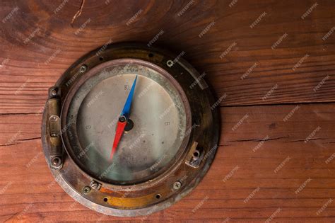 Premium Photo Old Magnetic Antique Brass Ships Compass Mounted On A