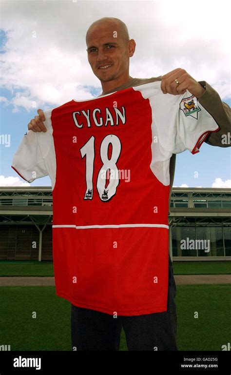 Pascal Cygan Holds His New Shirt After Signing To Arsenal Hi Res Stock