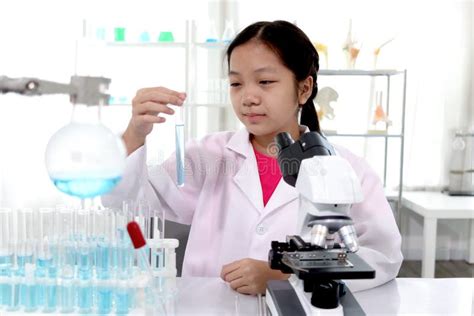 Adorable Schoolgirl In Lab Coat Doing Science Experiments Young