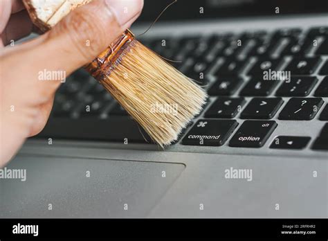 Cleaning Dust From Computer Keyboard Stock Photo Alamy