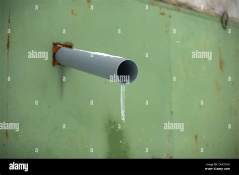 Pipe For Draining Water Ice On Pipe Drainage Of Water From Building Sewerage System Stock
