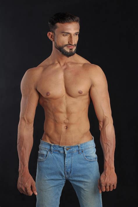 Portrait Of A Young Pakistani Gym Fit Shirtless Male Model Showing His