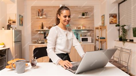 Free Photo Freelance Businesswoman Sitting At Desk In Home Working On Laptop Concentrated