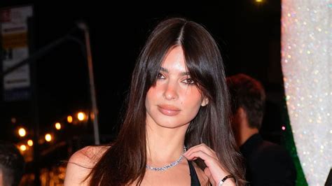 The Front Of Emily Ratajkowskis Plunging Holiday Dress Was Completely
