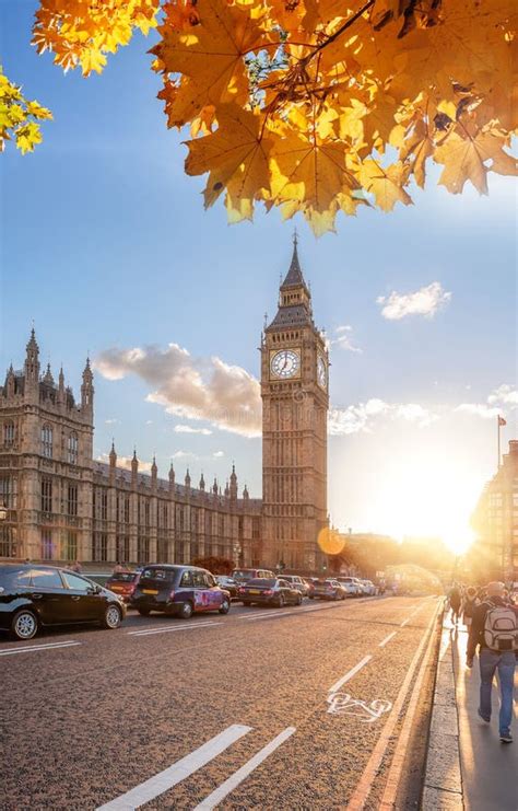 Big Ben Against Colorful Sunset With Autumn Leaves In London England