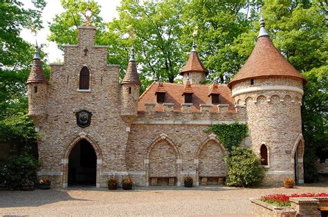 An Old Castle Like Building With Towers And Turrets