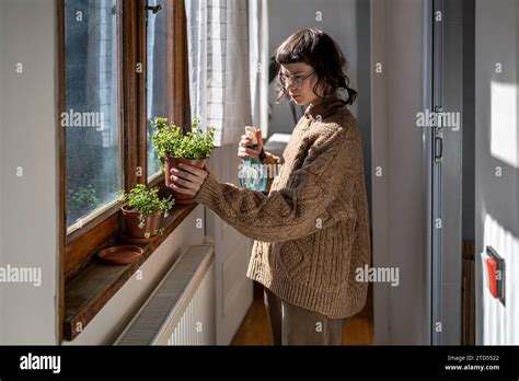 Caring Teen Girl Pouring Spraying Water Watering Potted Flower