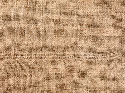 Brown Burlap Laying On White Sheet Abstract Background Texture Of Sackcloth Burlap Fabric