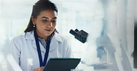 Scientist Woman And Tablet With Microscope For Chemistry Testing And Medical Research Biotech