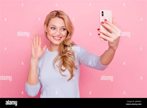 Photo Of Lovely Satisfied Person Make Selfie Arm Palm Waving Hi