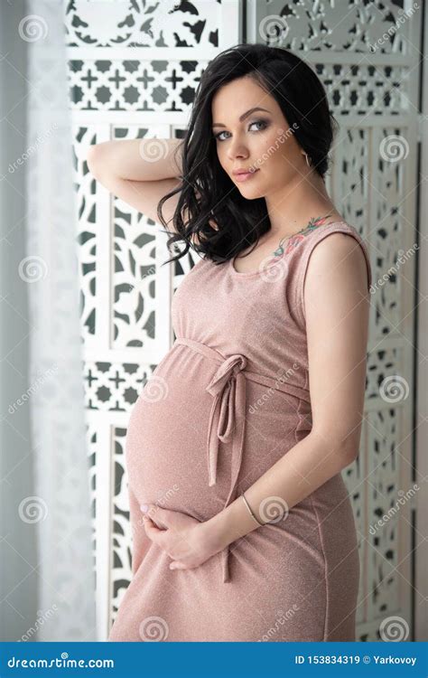 Women`s Health And Pregnancy A Beautiful Pregnant Woman In A Tender