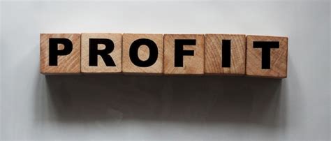 Premium Photo Concept Word Profit On Wooden Cubes On Gray Background Business Concept