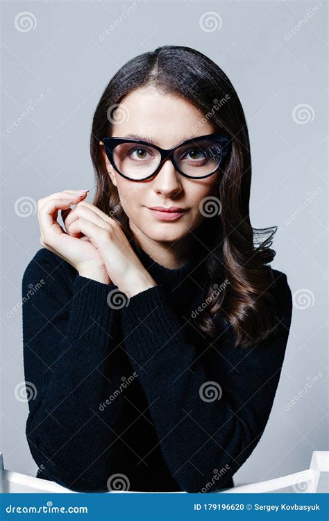 Young Beautiful Business Woman In Stylish Glasses Posing In Studio