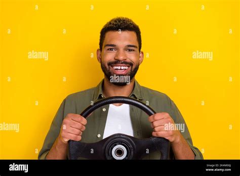 Photo Of Positive Good Mood Man Wear Khaki Shirt Driving Vehicle