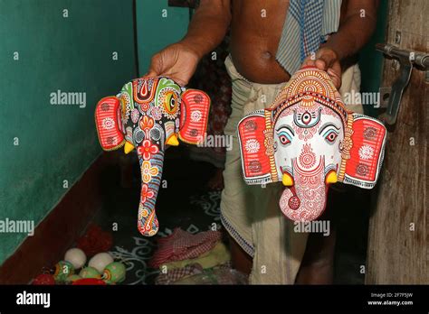 Tribal Artisan Showing Colorful Paper Mache Handmade Statue Of Lord