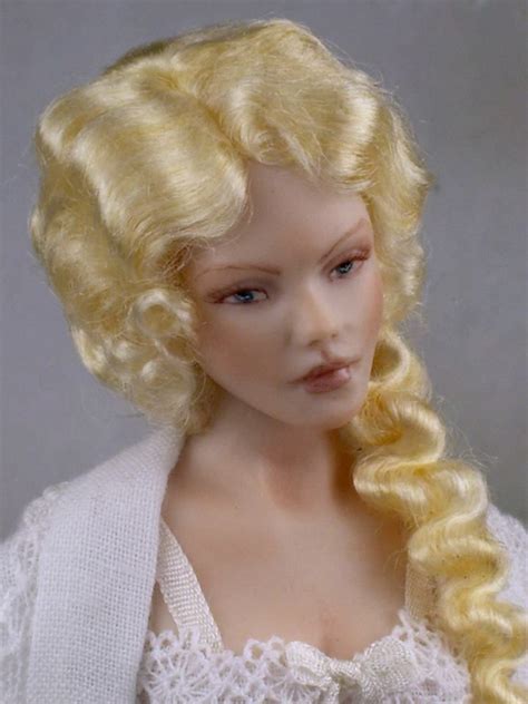 A Close Up Of A Doll With Blonde Hair