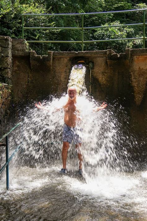 A Man Refreshing Himself In An Artificial Shower Stock Photo Image Of Lake Person