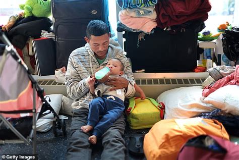 Migrants Sleeping At Chicago Police Stations Say They Are Treated