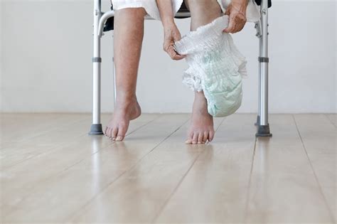 Premium Photo Elderly Woman Changing Diaper