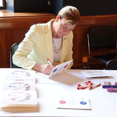 Download Tammy Baldwin Signing Christmas Cards Wallpaper