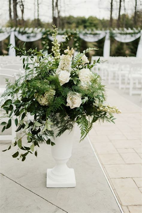 This Photo Features An Outdoor Wedding Ceremony With White Ceremony