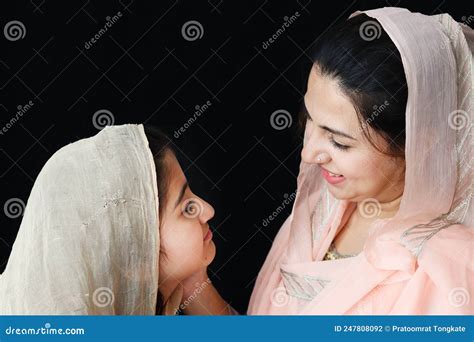 Adorable Smiling Pakistani Muslim Girl With Beautiful Eyes Looks At Her