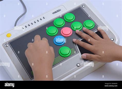 Hand Playing The Old Joystick Controller With White Background Stock